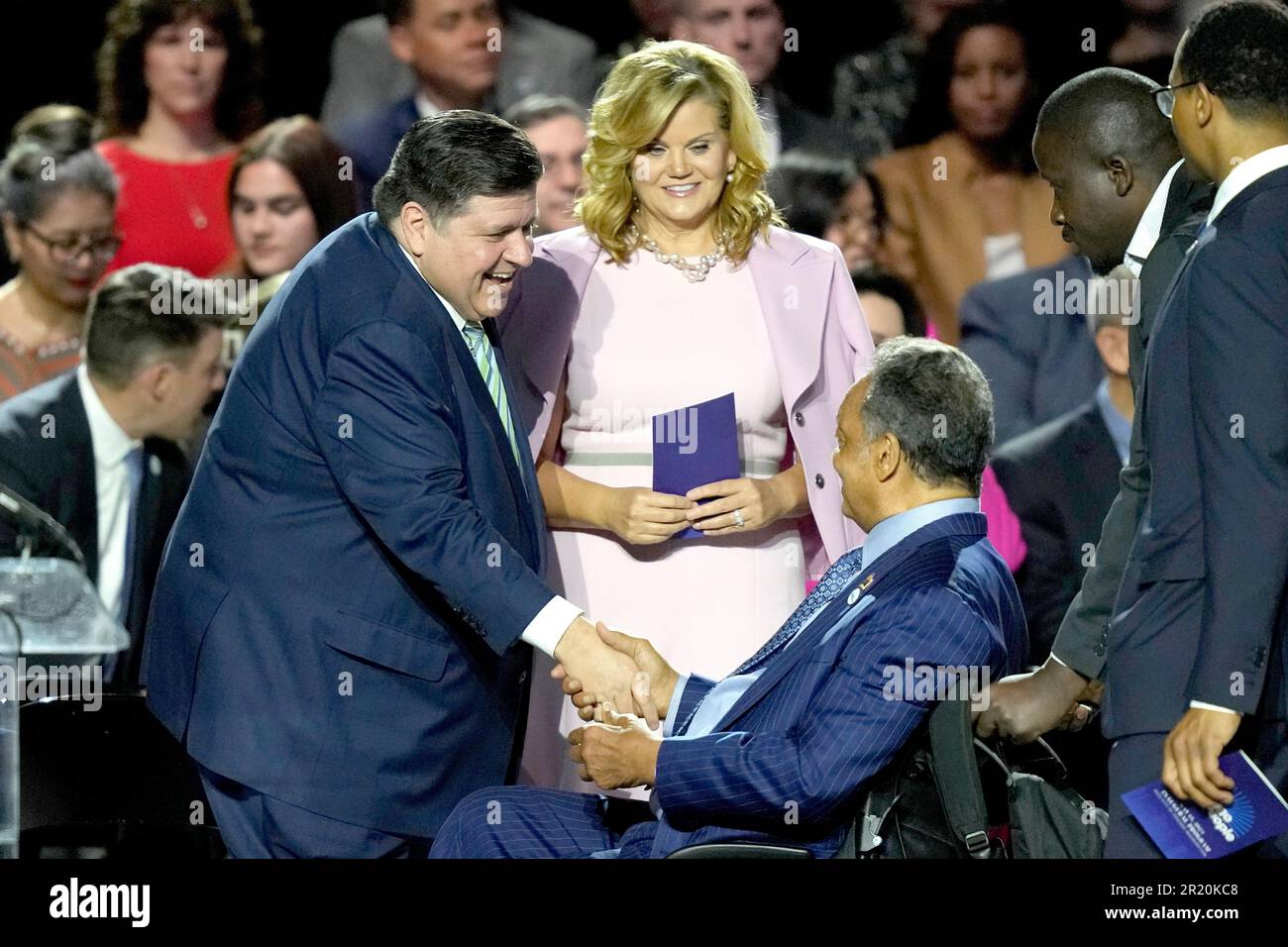 Illinois Gov. J.B. Pritzker, left, greets the Rev. Jesse Jackson Sr ...