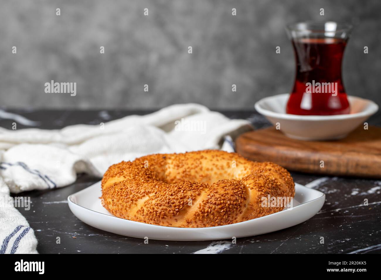 Sesame bagel on dark background. Turkish street food circular bread ...