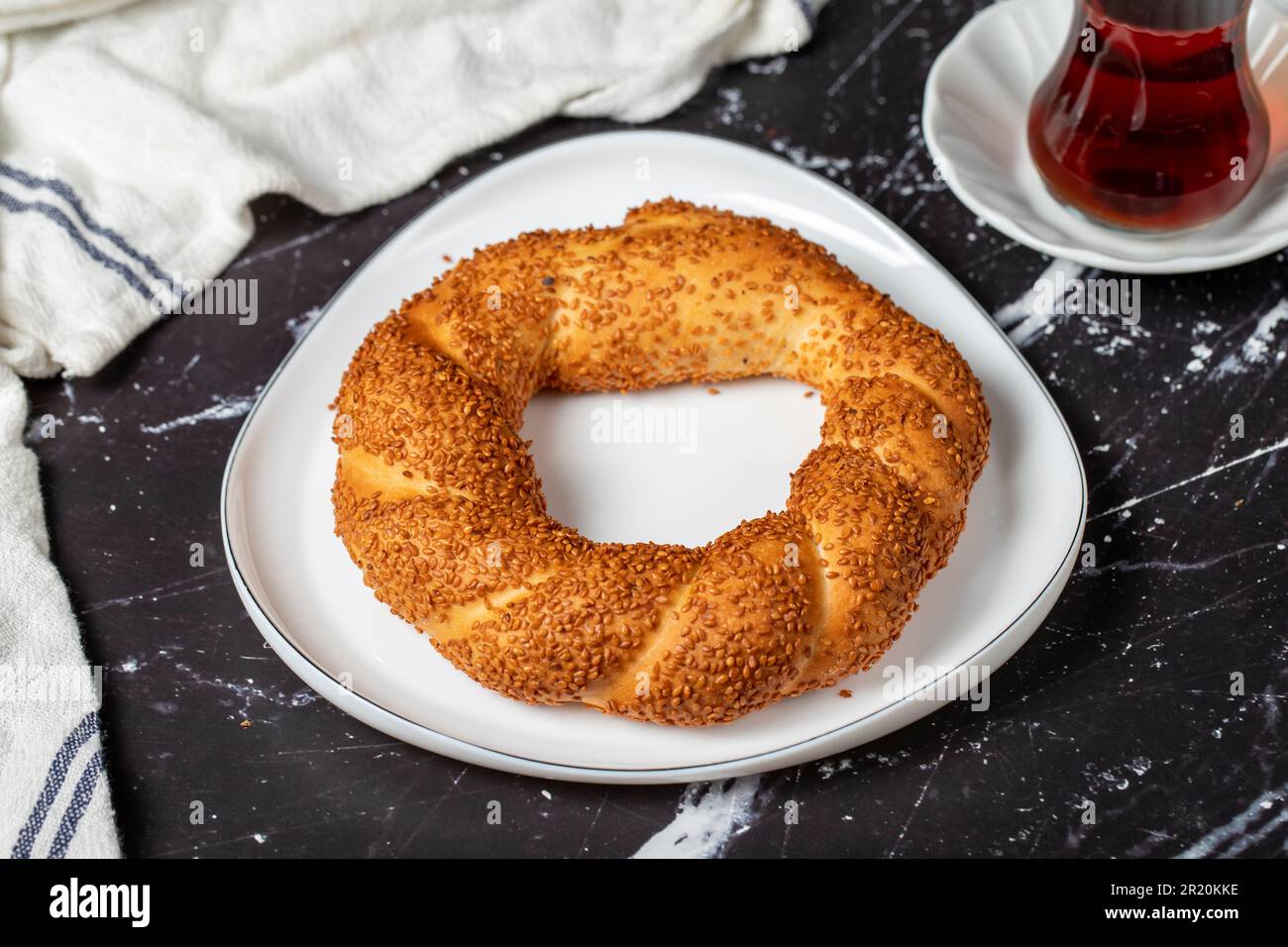 Sesame bagel on dark background. Turkish street food circular bread ...