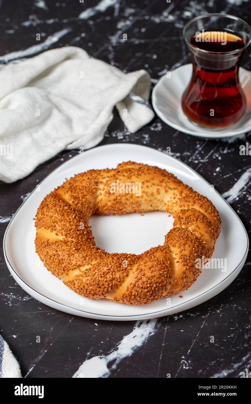 Sesame bagel on dark background. Turkish street food circular bread ...