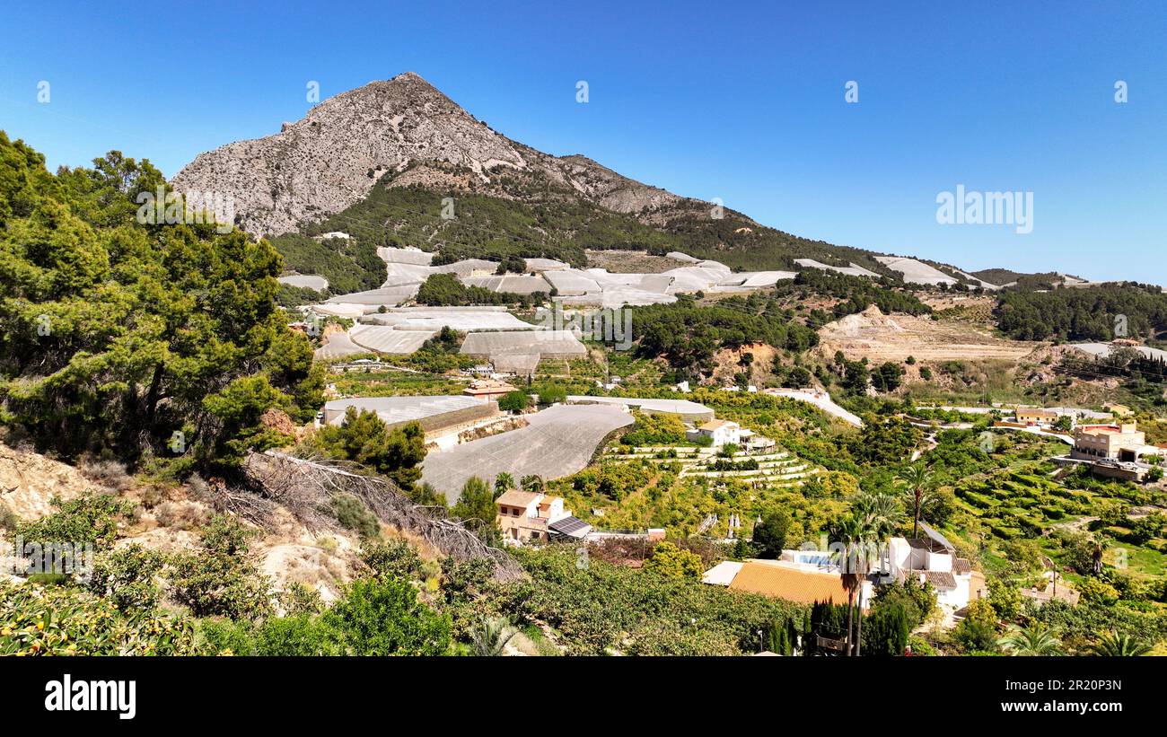Mountains with cultivated ‘vineyards’ farmland and greenhouse ...