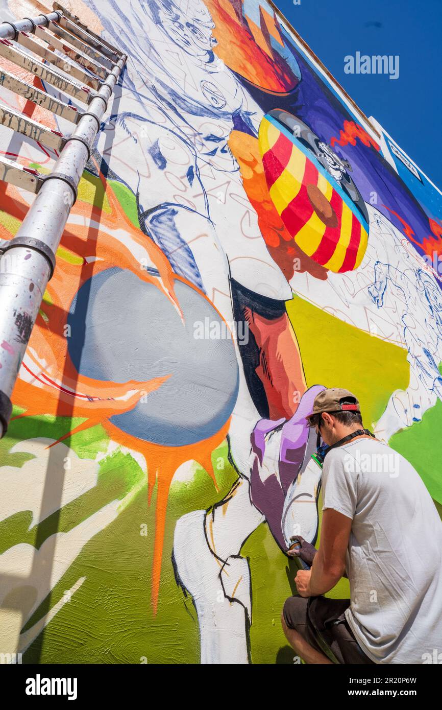 Graffiti Street artist Yeko into action in Spain Stock Photo - Alamy