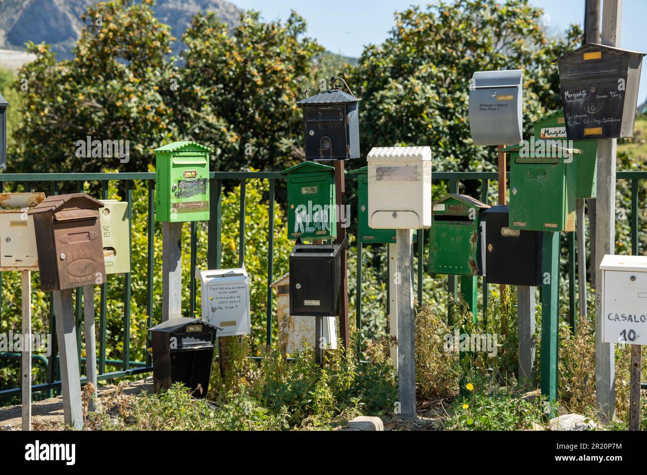 various colored mailboxes along the side of the road Stock Photo - Alamy