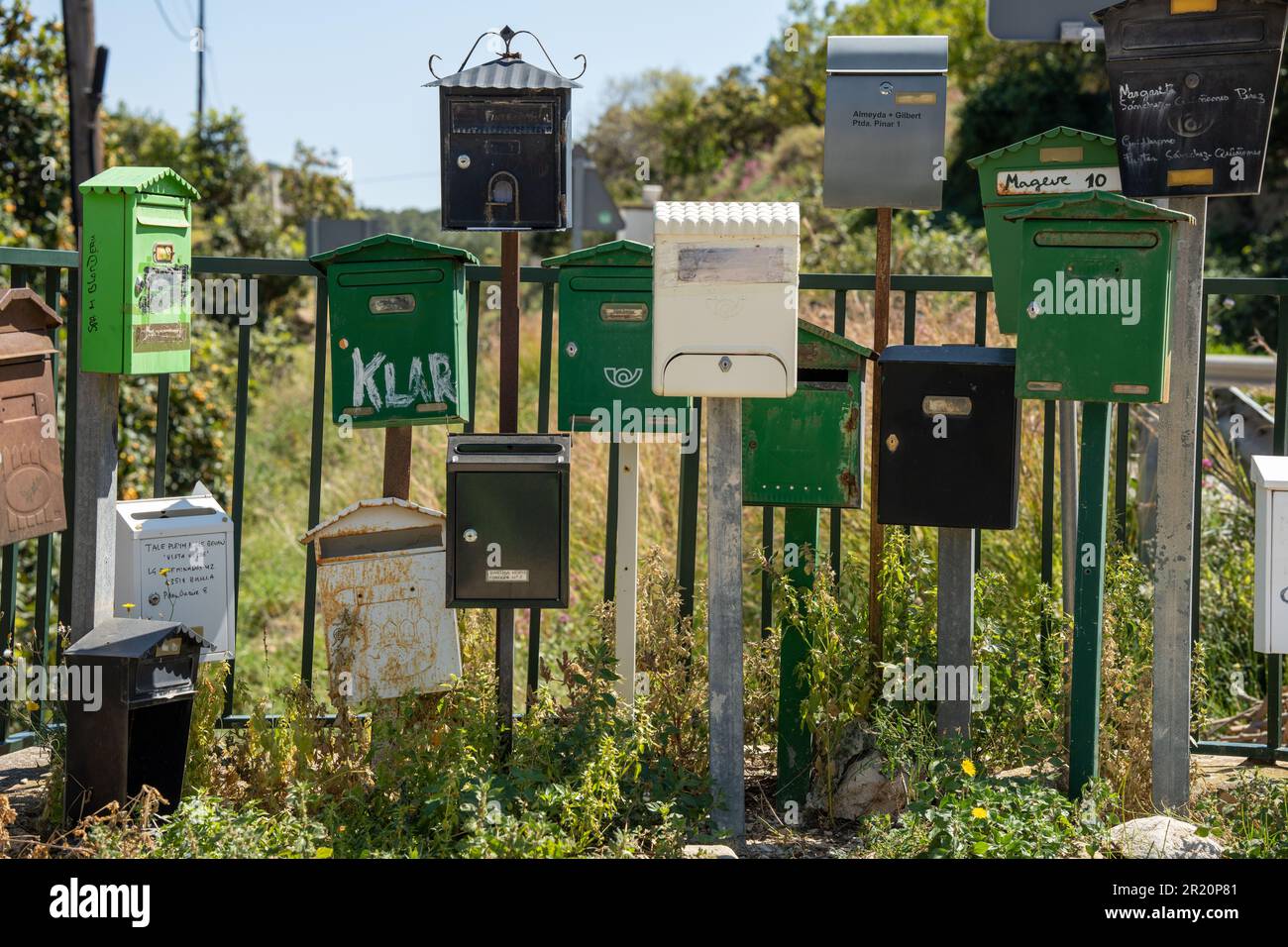 various colored mailboxes along the side of the road Stock Photo - Alamy