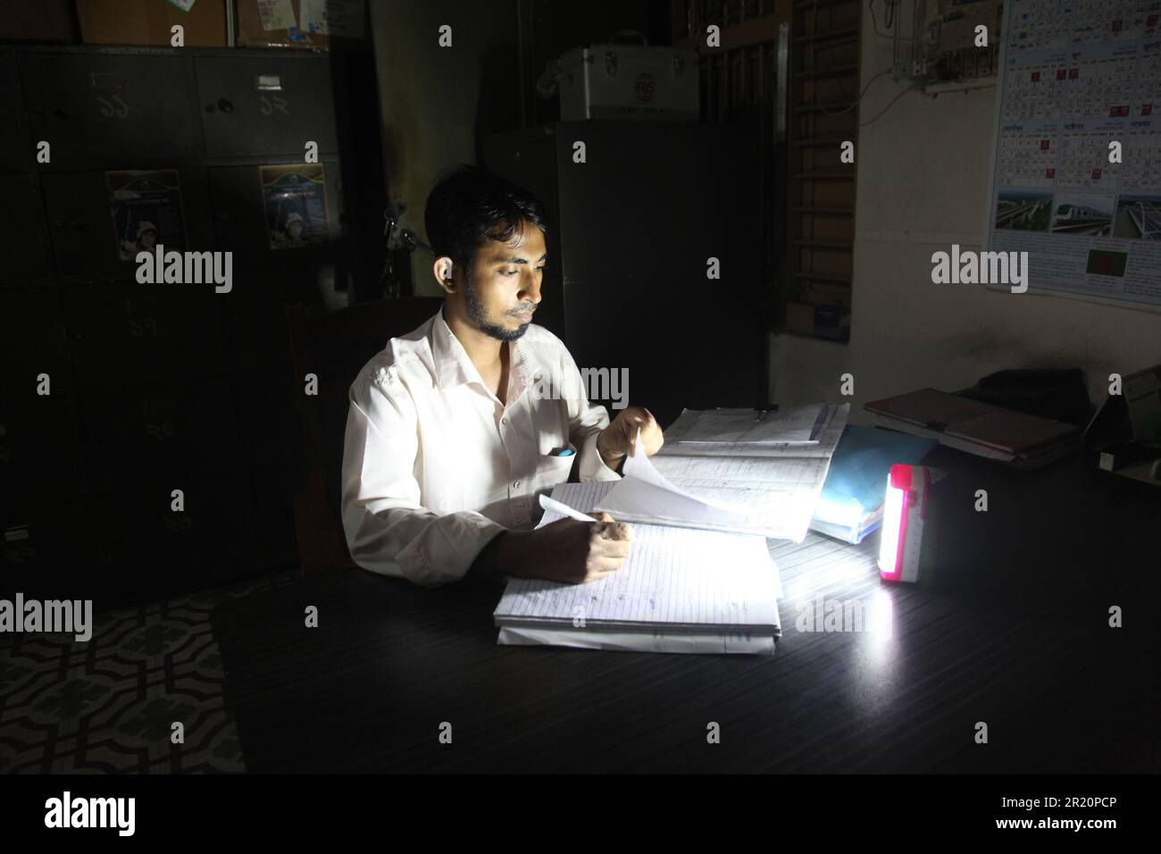 Load shedding 16 may2023,paltan dhaka bangladeshA man is working with ...