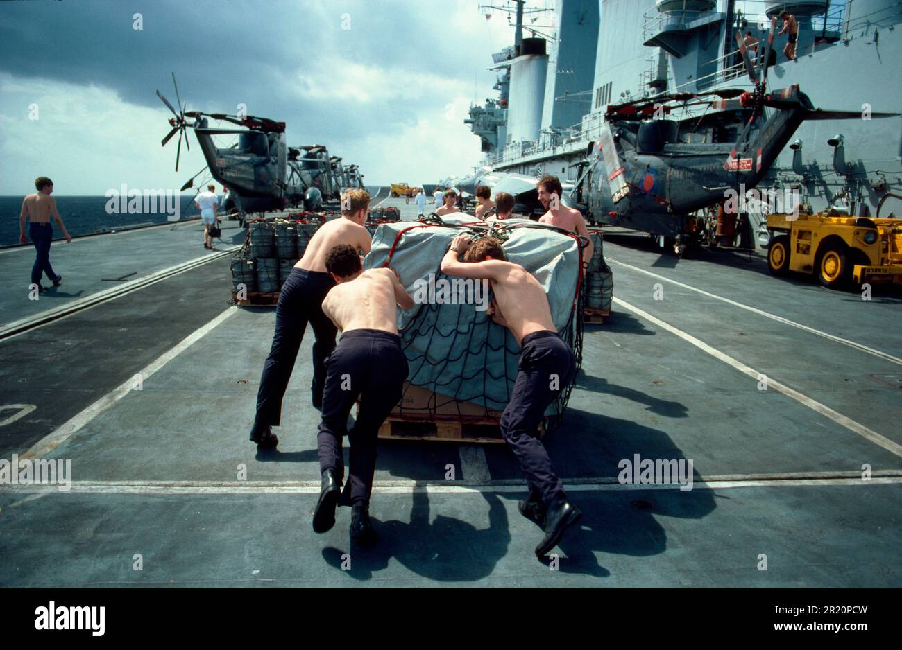 Loading supplies on the deck of the HMS Invincible, 1984 Stock Photo ...