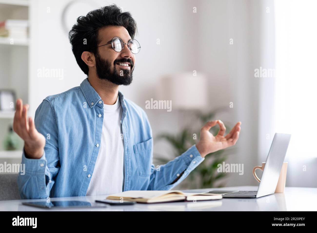 Coping With Working Stress. Smiling Calm Indian Man Meditating At Home ...