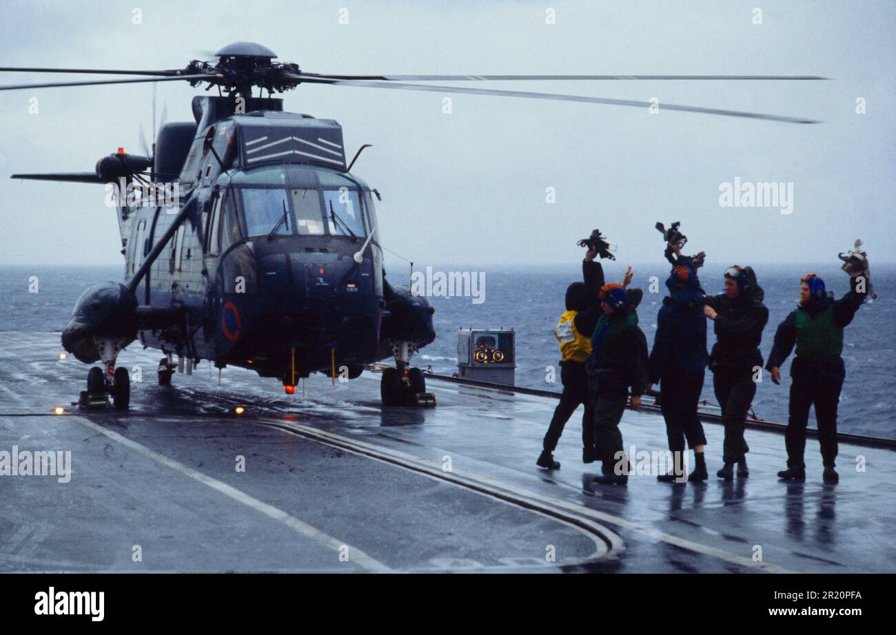 Sea King helicopter ground crew on the HMS Invincible, 1984 Stock Photo ...