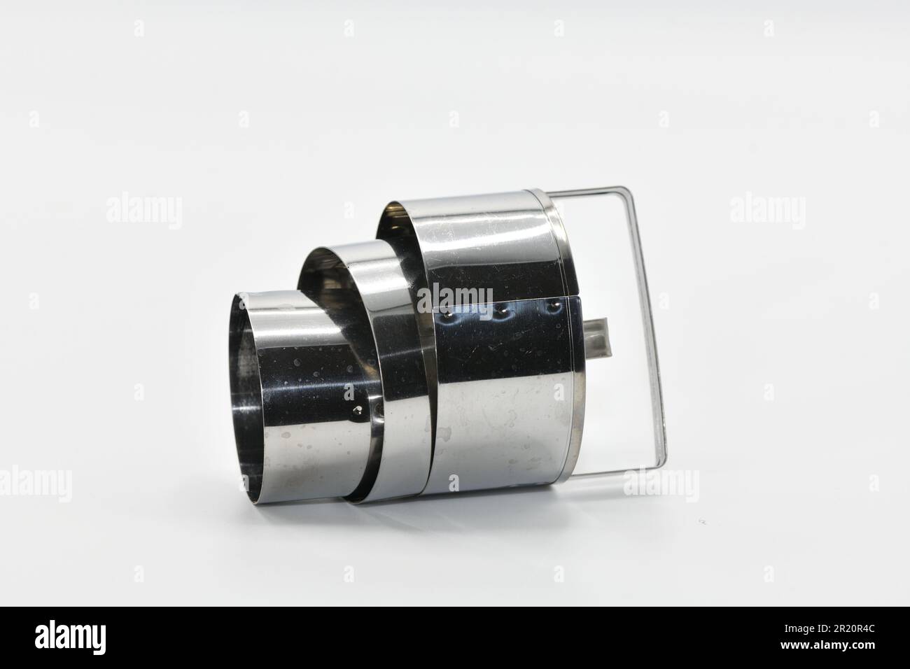 Stainless steel biscuit cutters on a white background Stock Photo - Alamy