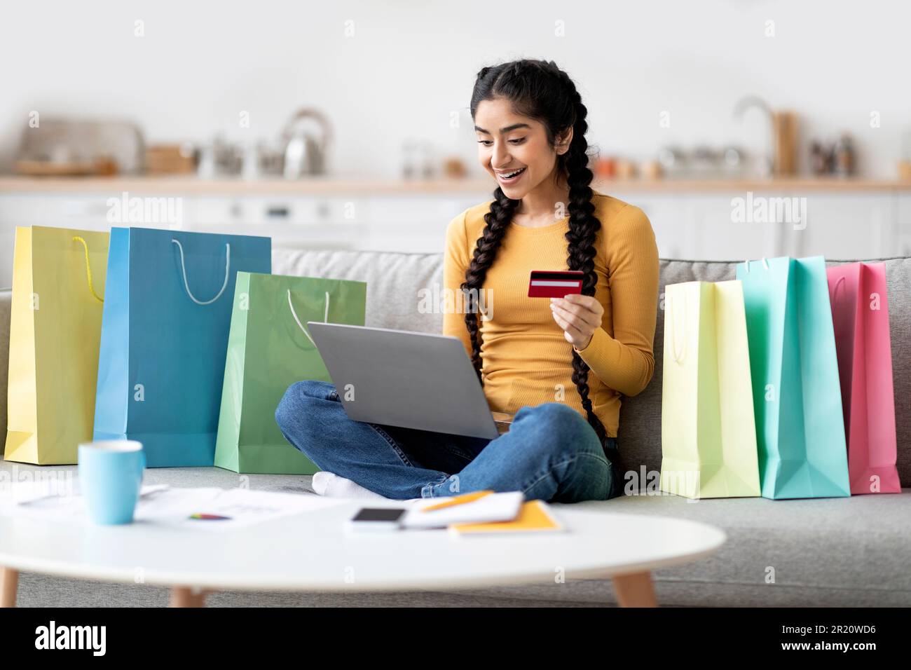Indian Female Making Online Shopping With Laptop And Credit Card At ...