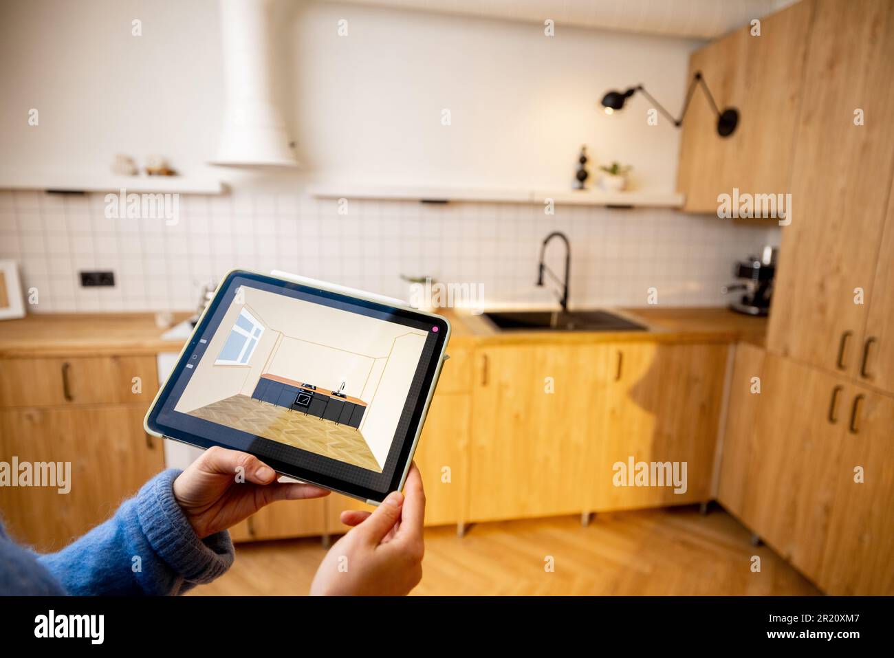 Designing kitchen space with a digital tablet Stock Photo - Alamy