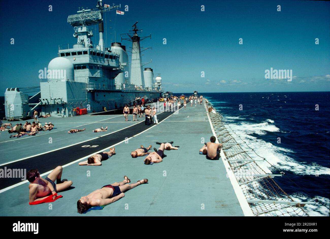The flight deck, sunbathers, on the HMS Invincible in the West Indies ...