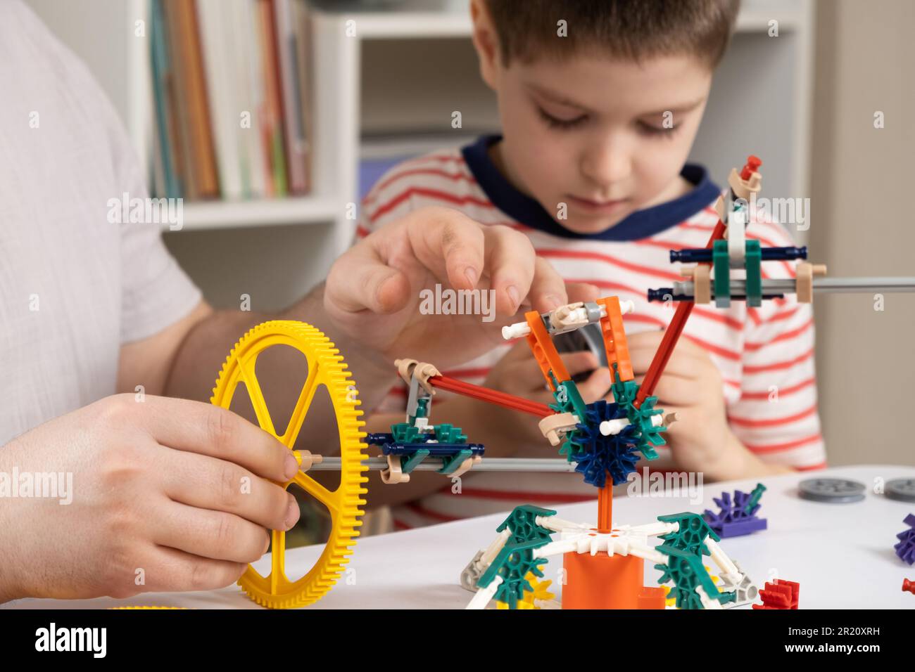 Dad and son build figures from the constructor. Spending time together ...