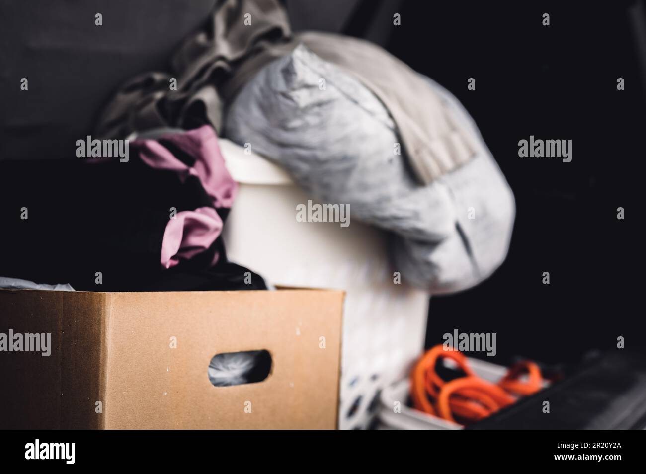 Cloths and material bagged and boxed for donation in the back of a ...