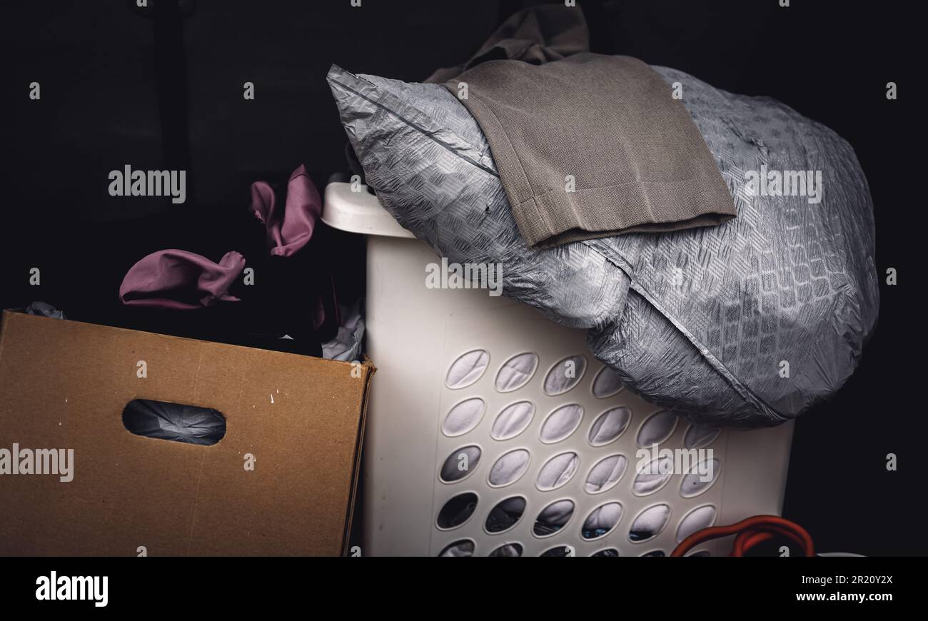 Cloths and material bagged and boxed for donation in the back of a ...