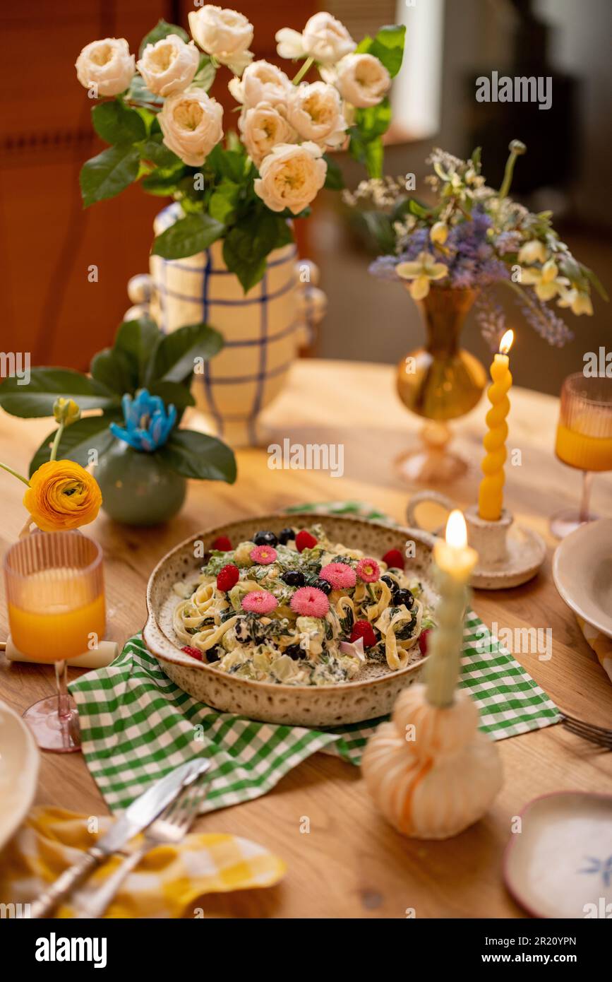 Pasta on beautifuly decorated table Stock Photo - Alamy