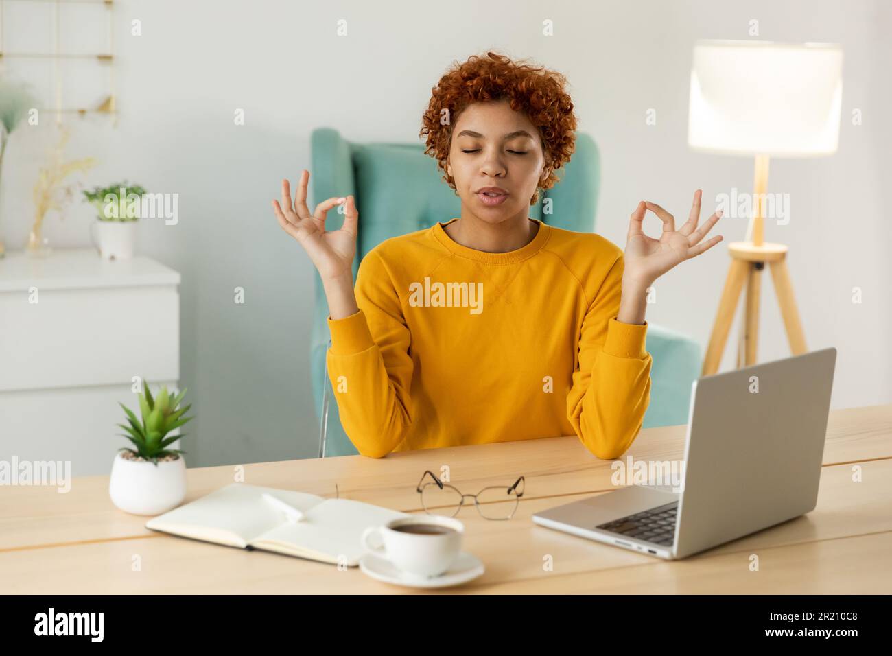 No stress keep calm. Mindful african businesswoman practices breathing ...