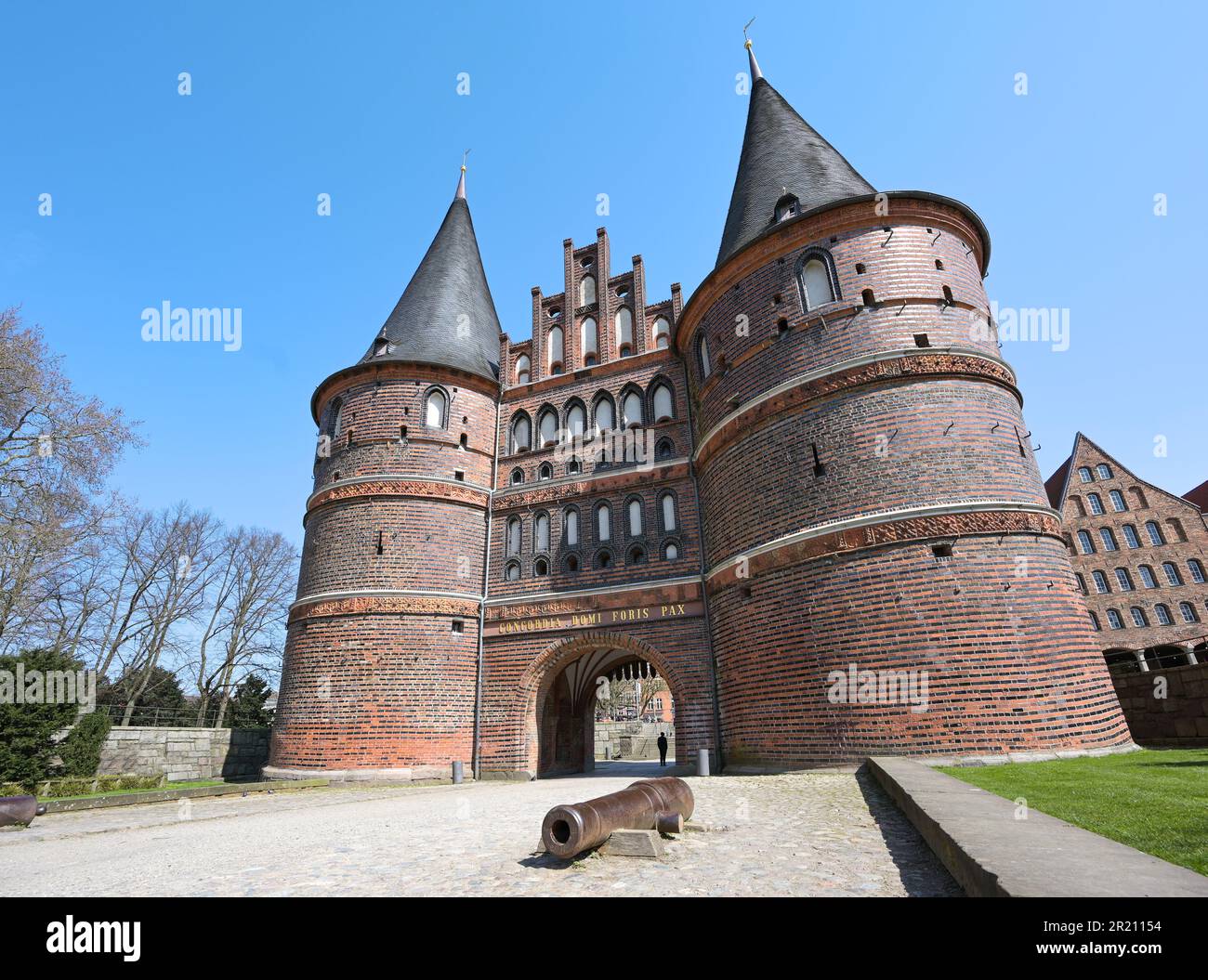 Lubeck Holstentor (Holsten gate) with canon, famous historic landmark ...