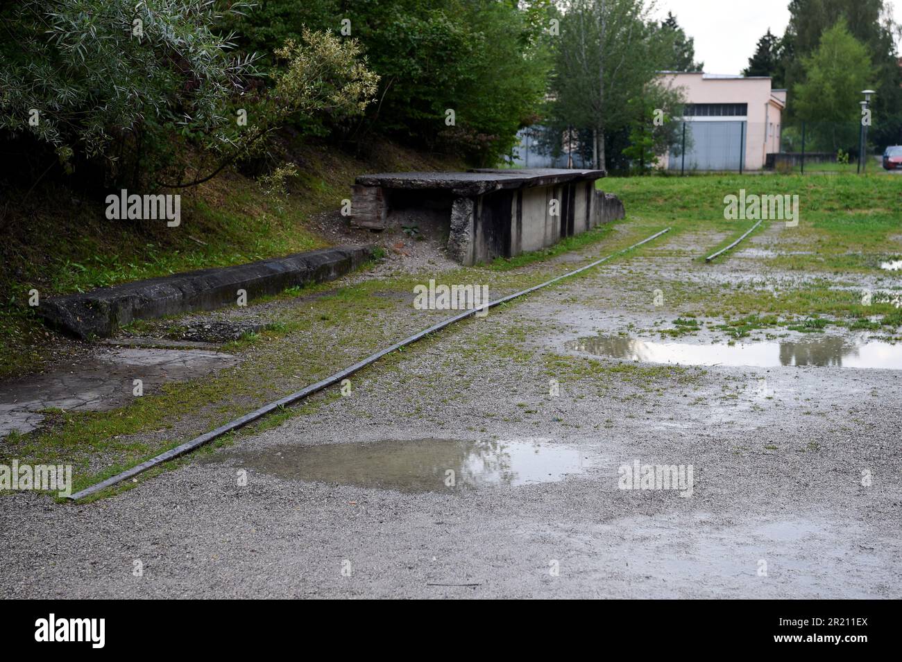 Photograph of train tracks at Dachau concentration camp. The camp was ...