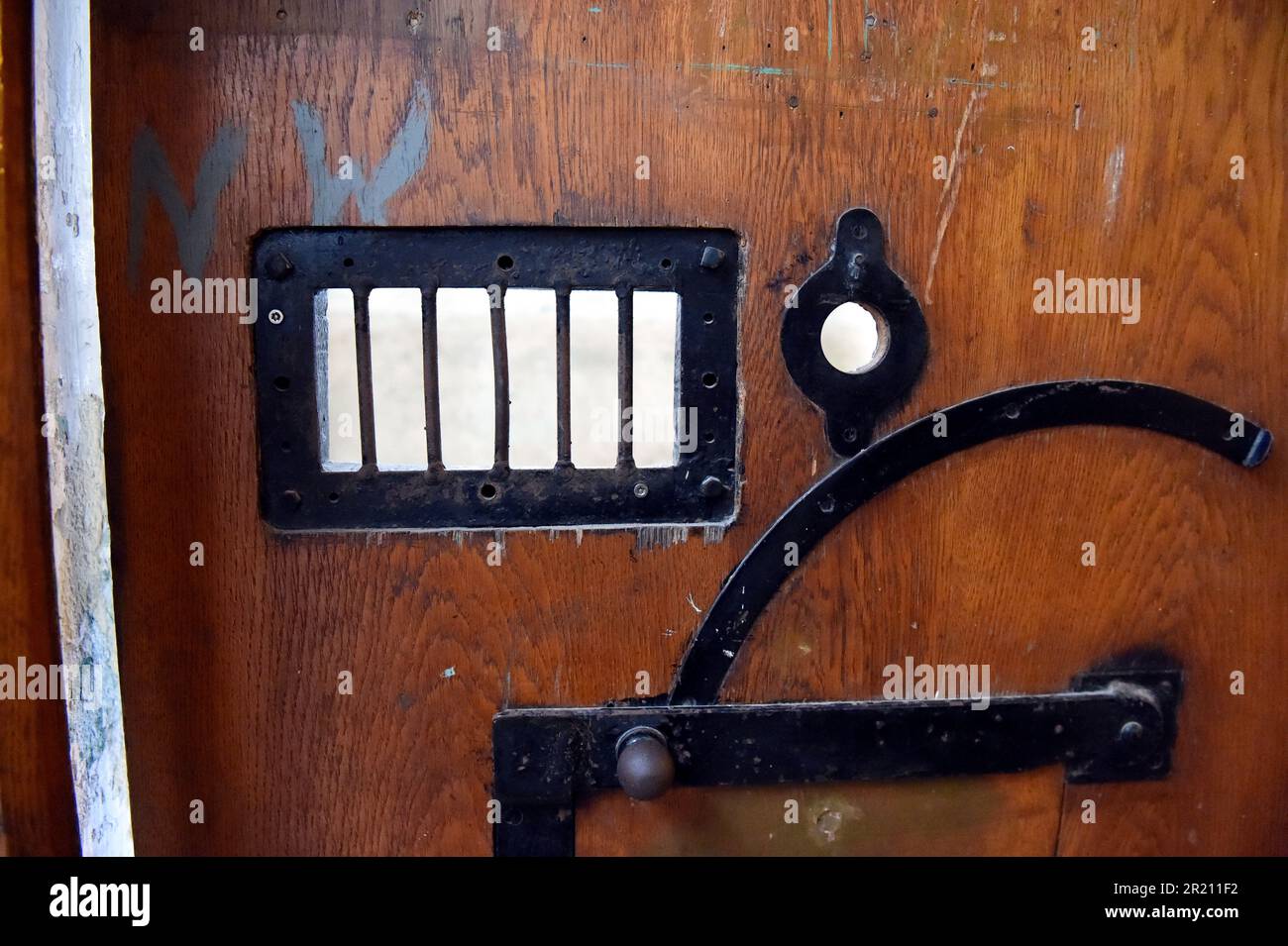 Photograph of a cell door at Dachau concentration camp. The camp was ...