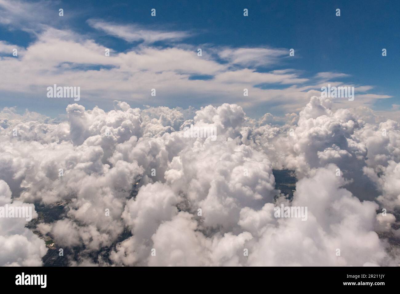 Aerial view of Clouds outside of an airplane window on a trip from ...