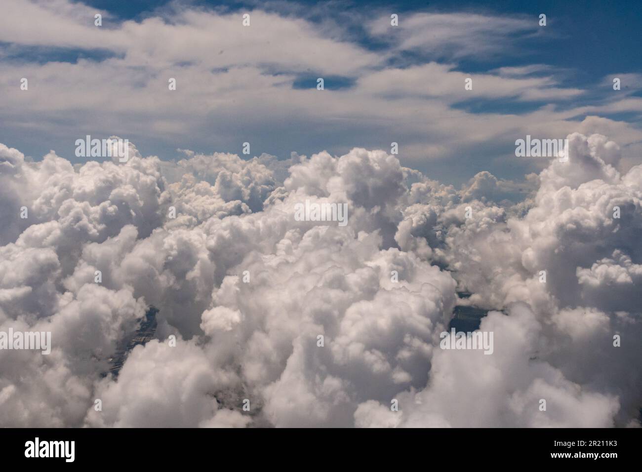 Aerial view of Clouds outside of an airplane window on a trip from ...