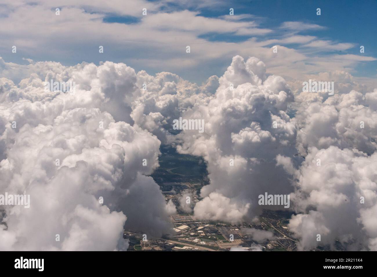 Aerial view of Clouds outside of an airplane window on a trip from ...