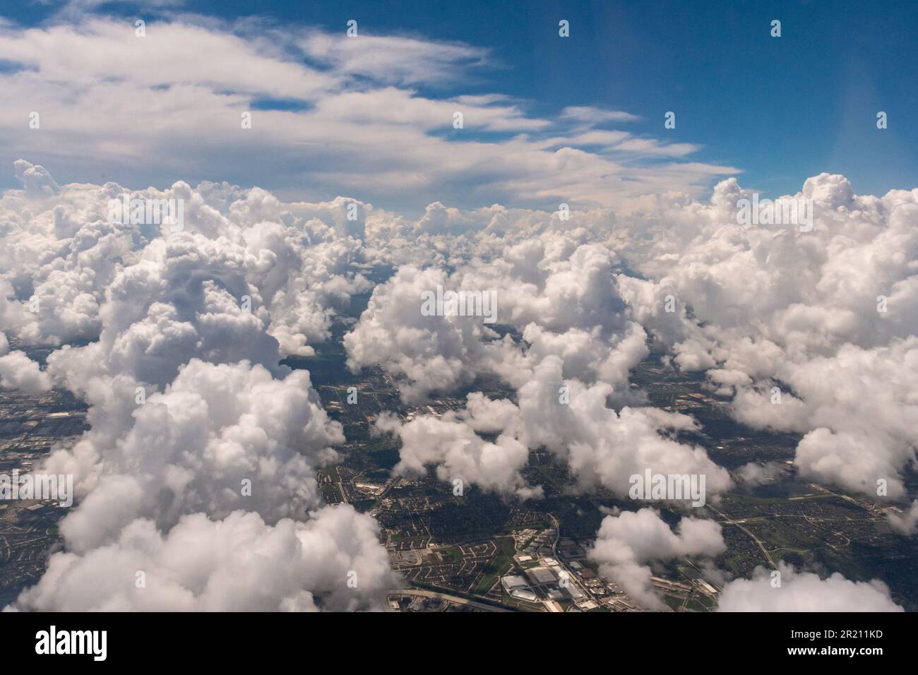 Aerial view of Clouds outside of an airplane window on a trip from ...