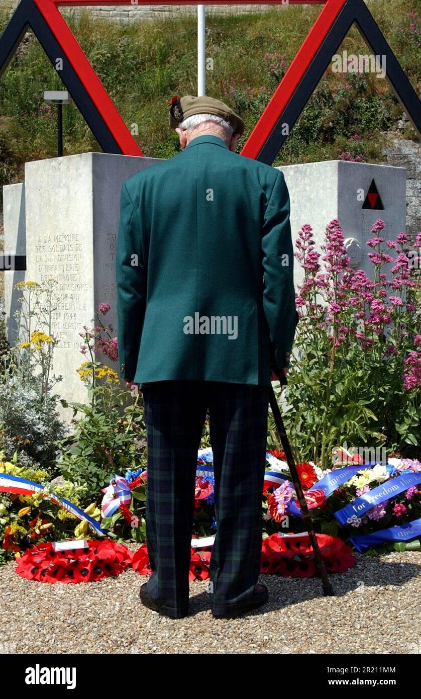 Photograph of Douglas Renny paying his respects during D-Day ...