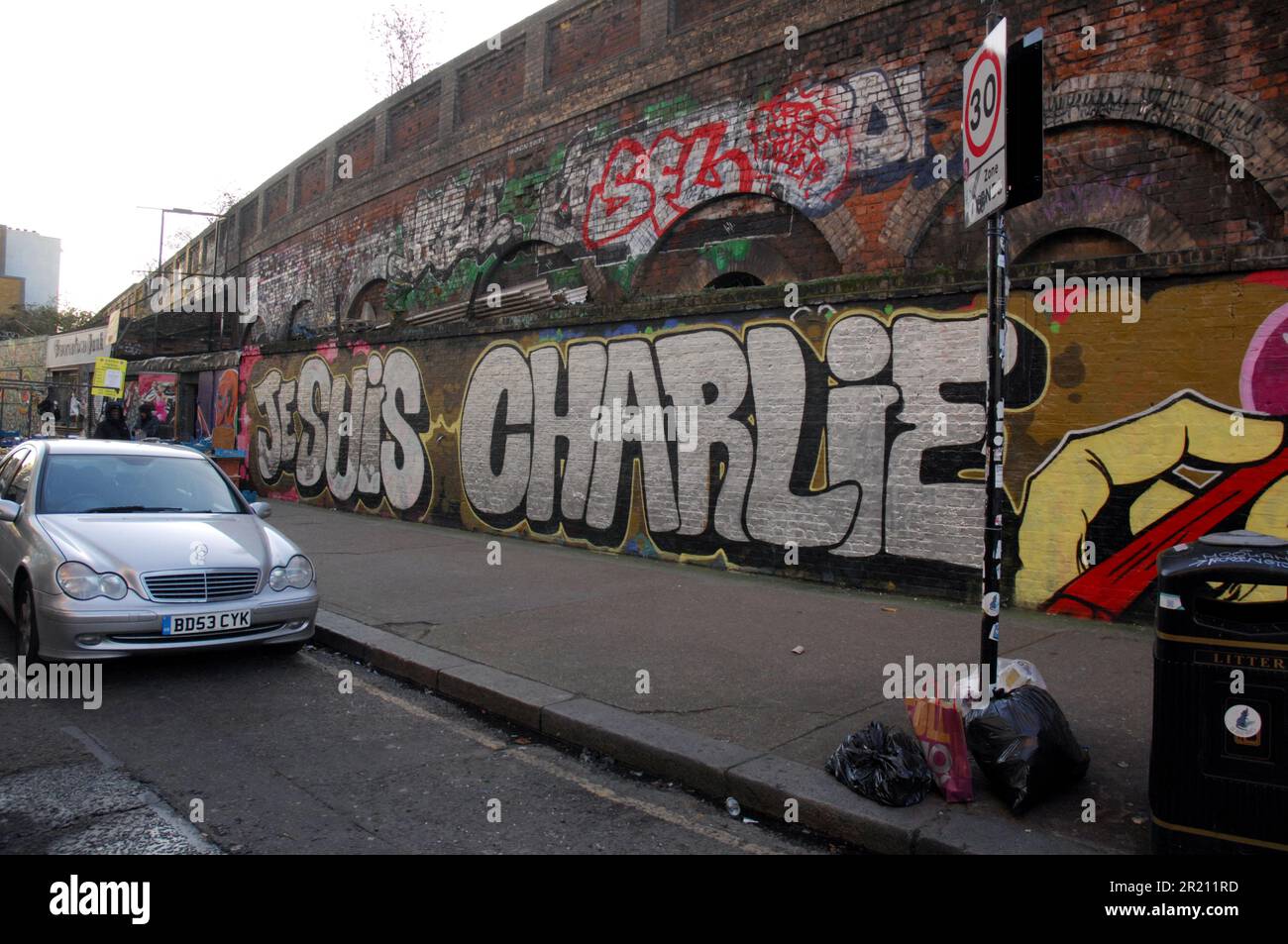 Photograph of graffiti on a wall in Hackney in support of the attacks ...