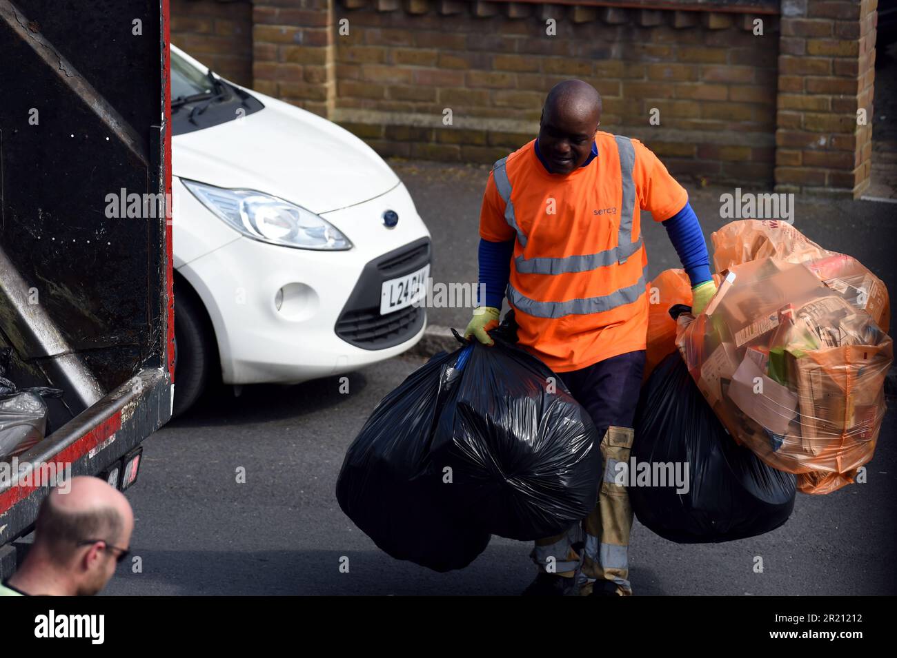 Photograph of refuse collectors working during the COVID-19 pandemic in ...