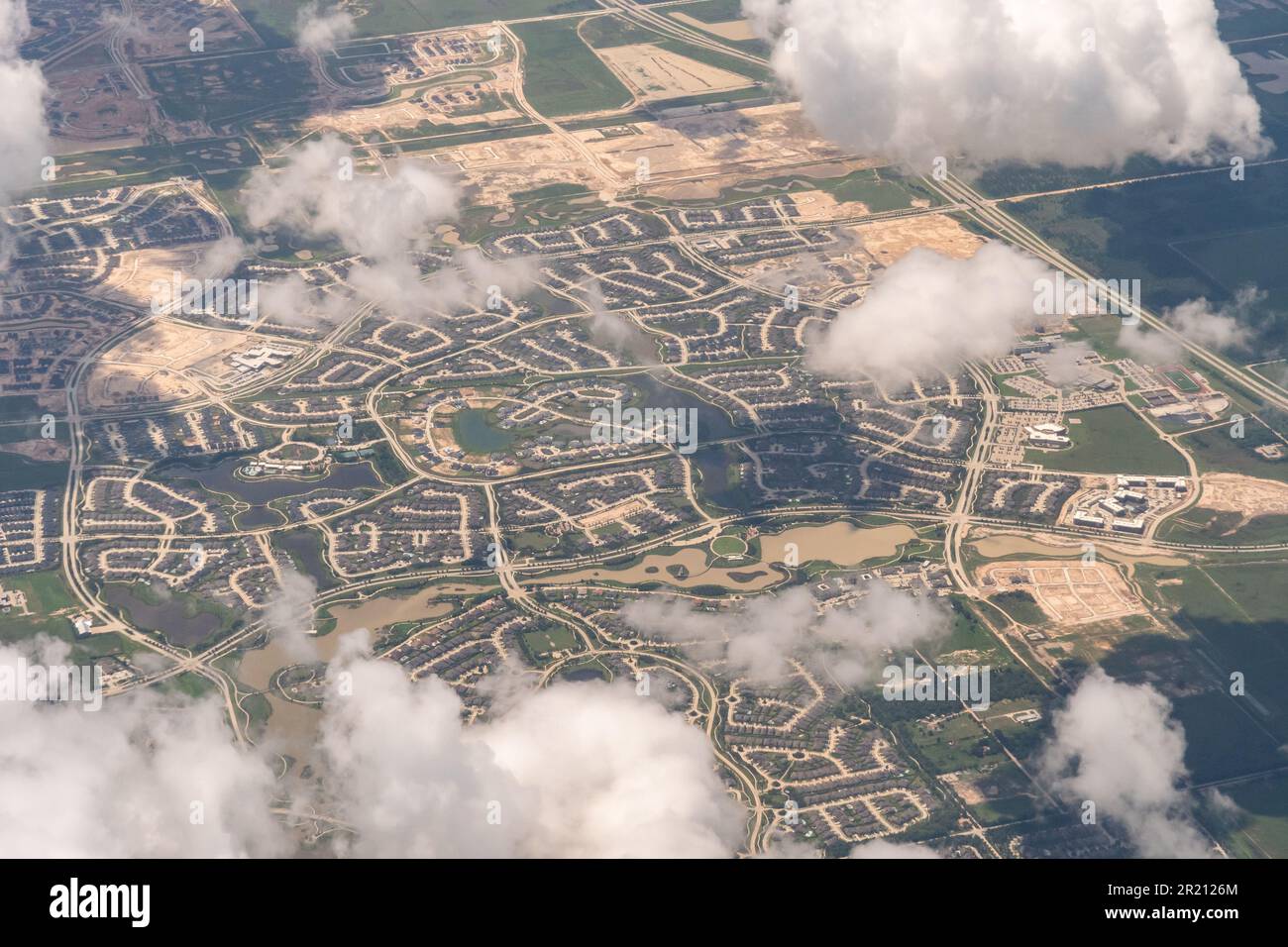 Aerial view of suburbs and suburban subdivisions and gated communities ...
