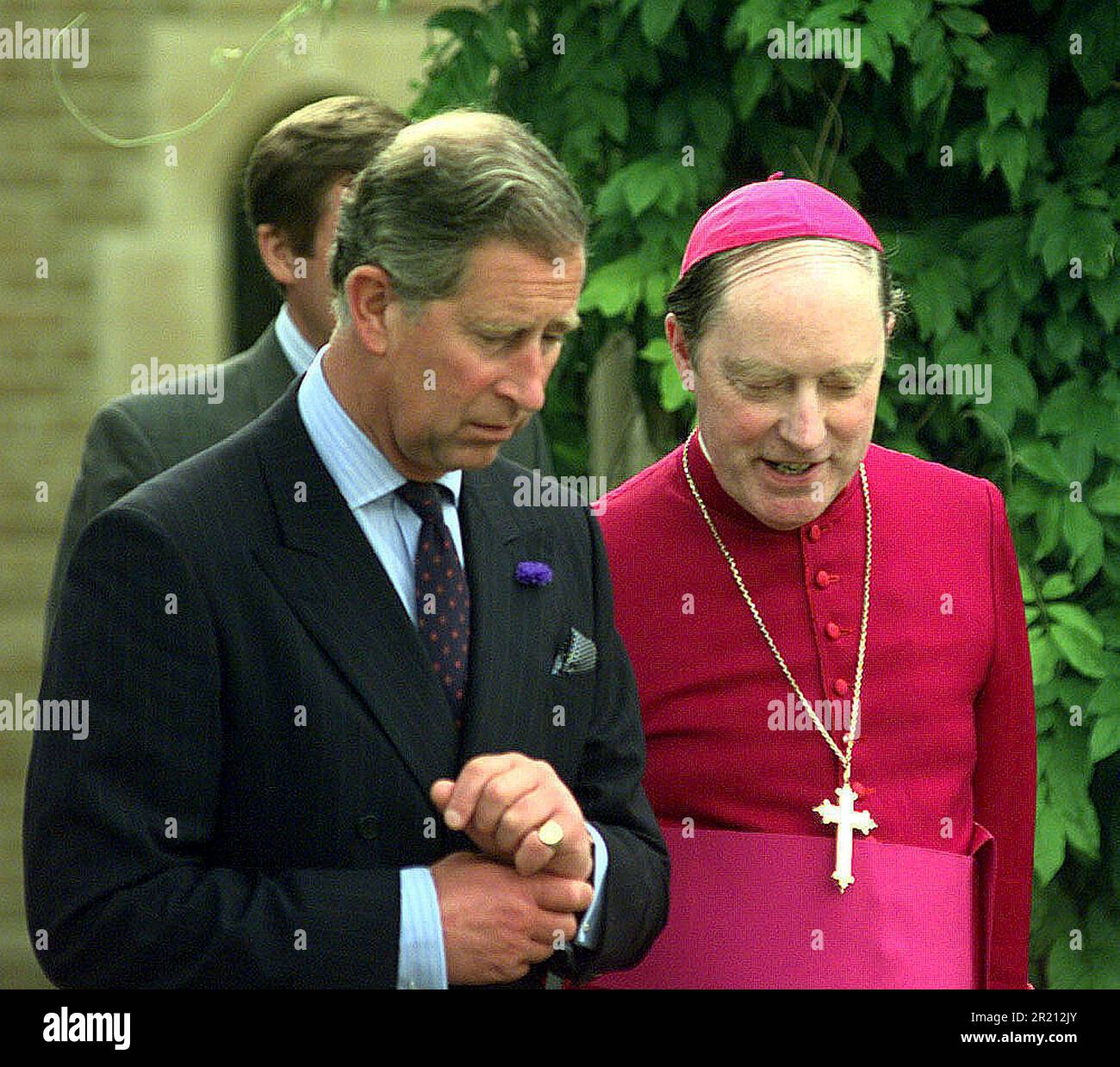 Photograph of Prince Charles talking to Bishop Thomas McMahon on a ...