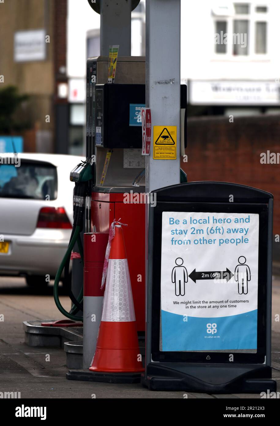 Photograph of a sign posted at a petrol station asking customers to ...