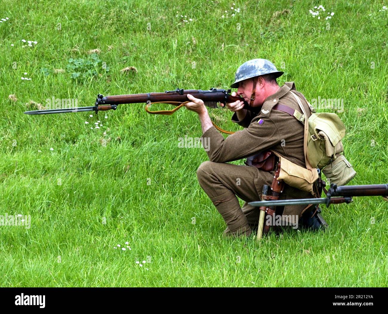 Photograph of soldiers pushing on enemy lines during a re-enactment of ...