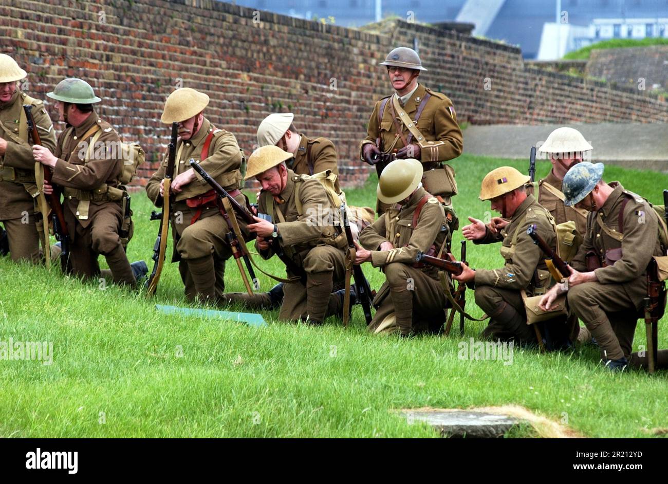 Photograph of soldiers pushing on enemy lines during a re-enactment of ...