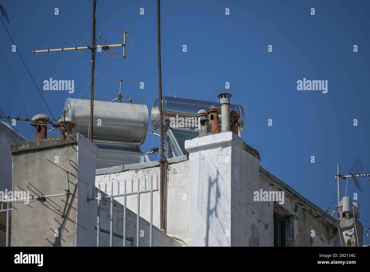 Thermosiphon systems with solar collector and water tank on the rooftop ...
