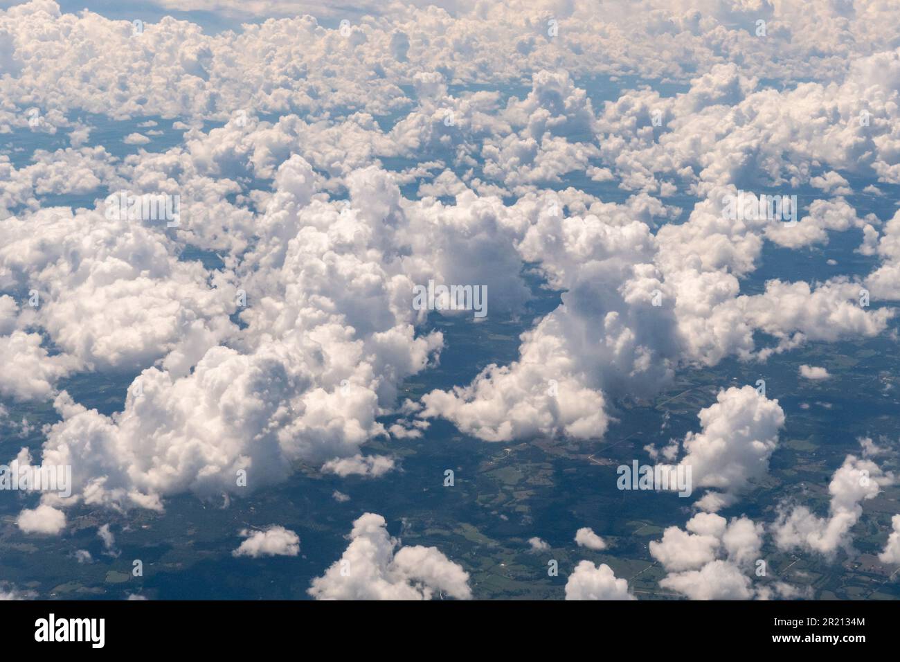 Aerial view of Clouds outside of an airplane window on a trip from ...