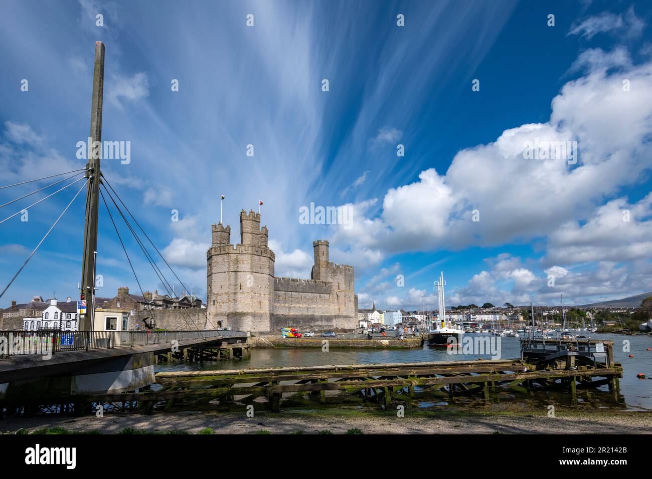 Caernarfon Castle and harbour on the river Seiont, Gwynedd, North Wales ...