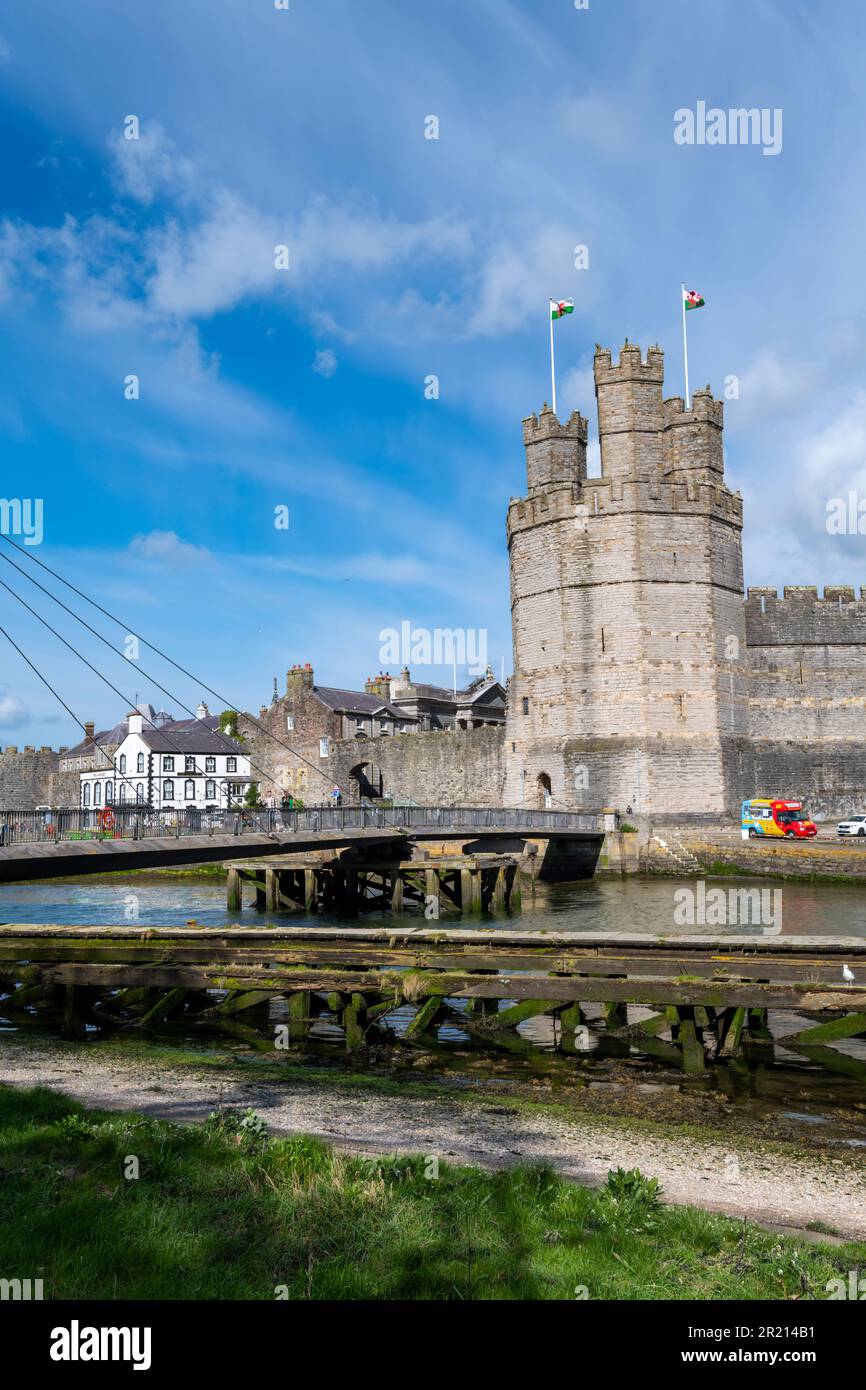 Caernarfon Castle and harbour on the river Seiont, Gwynedd, North Wales ...