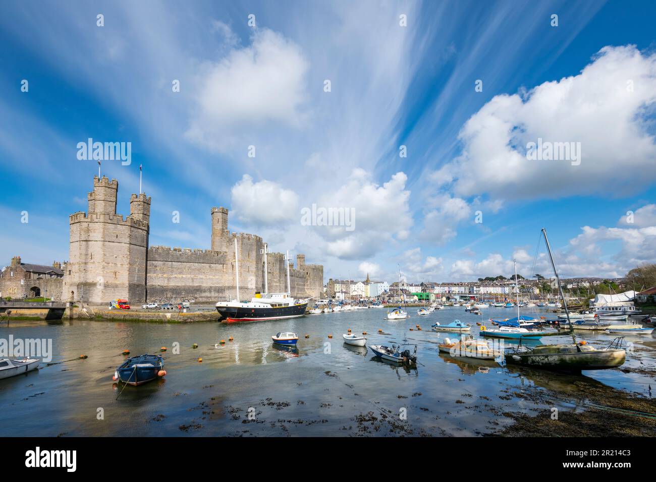 Caernarfon Castle and harbour on the river Seiont, Gwynedd, North Wales ...