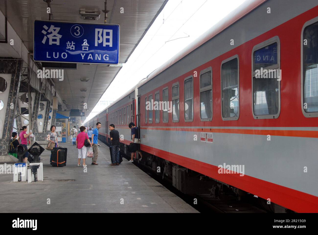 Passengers disembark from a train at Luoyang station, Luoyang, Henan ...