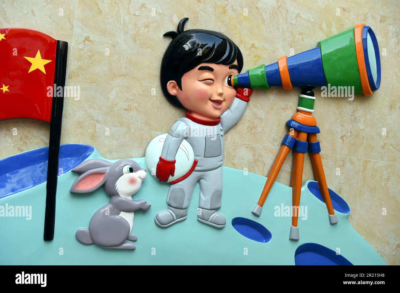 mural depicting a boy astronaut with a telescope, a rabbit and Chinese ...