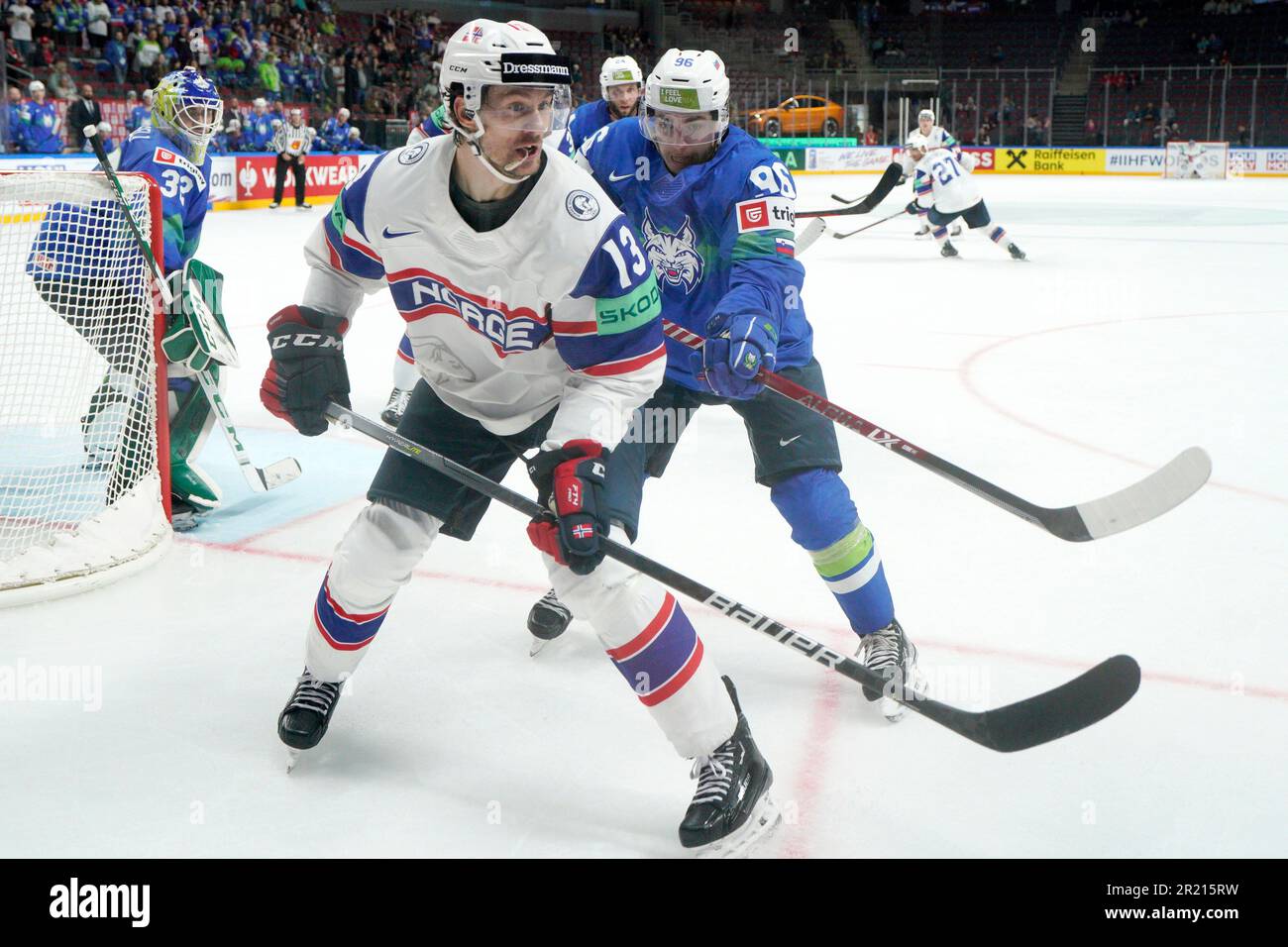 Bine Masic of Slovenia, right, fights for a puck with Sondre Olden of ...