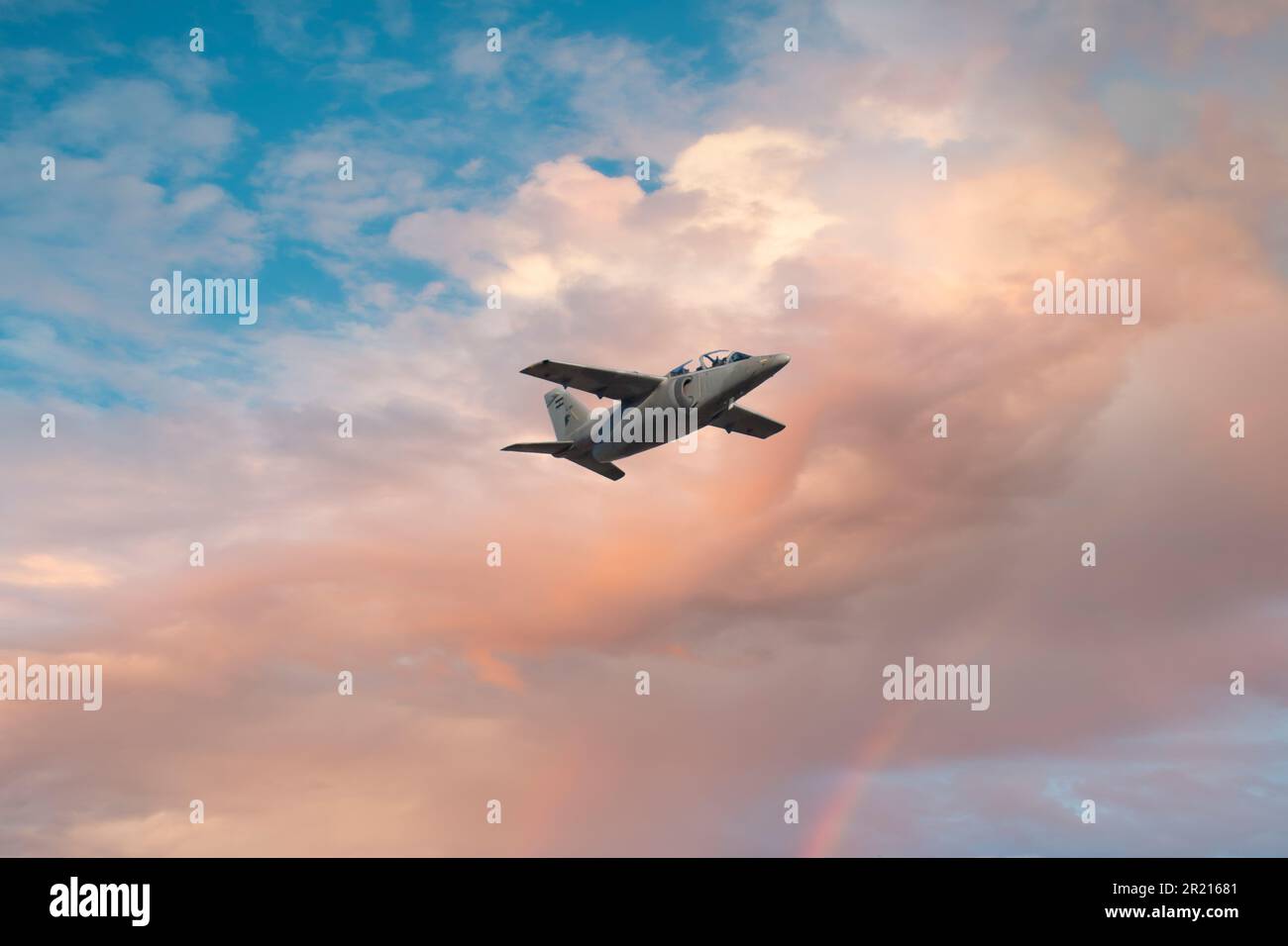 Military aircraft in flight at sunset Stock Photo - Alamy