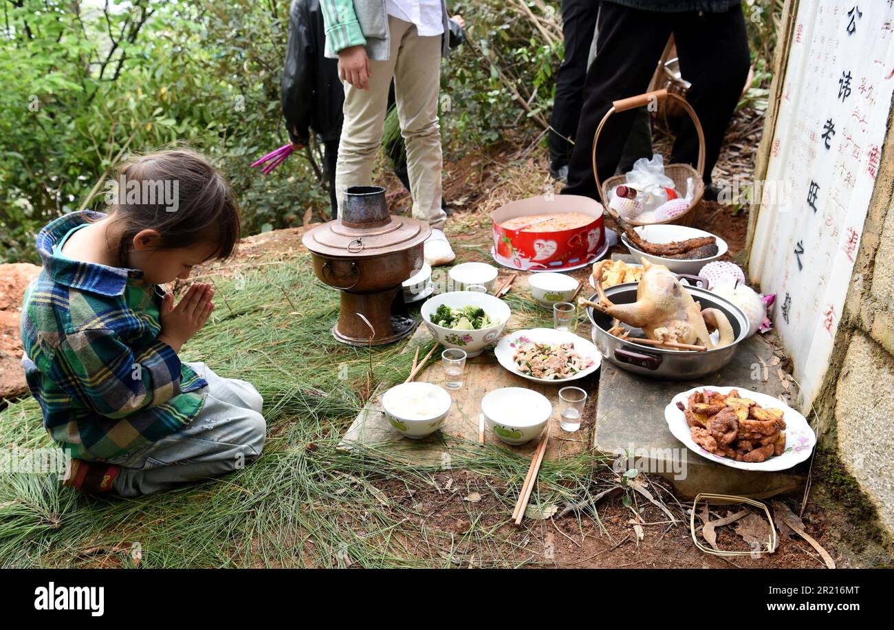 Chinese people partake in the Qingming, or Tomb-Sweeping festival, in ...