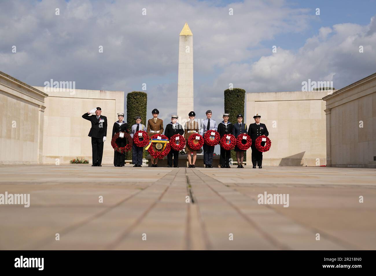 Military personnel hold wreaths on the Armed Forces Memorial during ...
