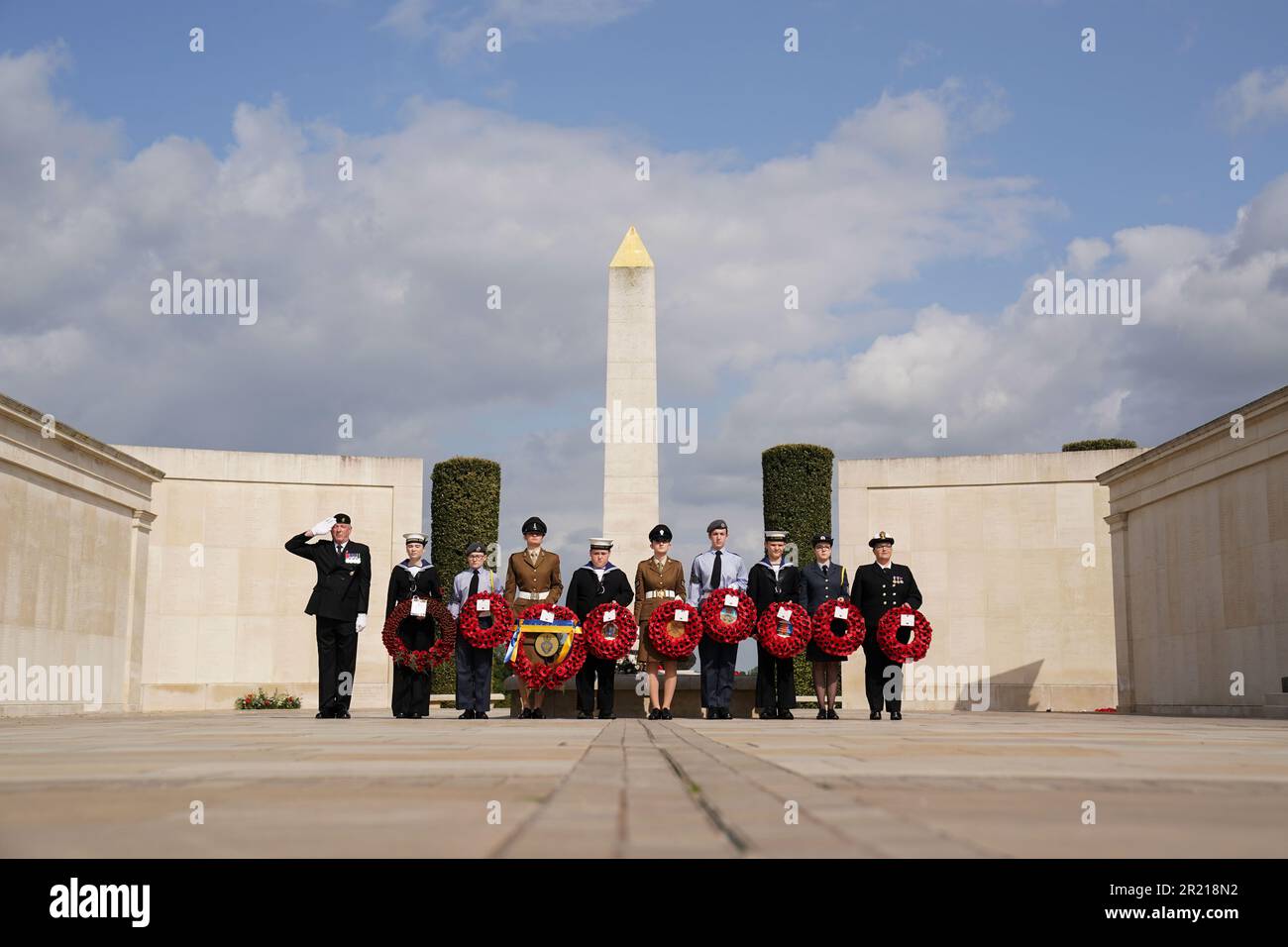 Military personnel hold wreaths on the Armed Forces Memorial during ...