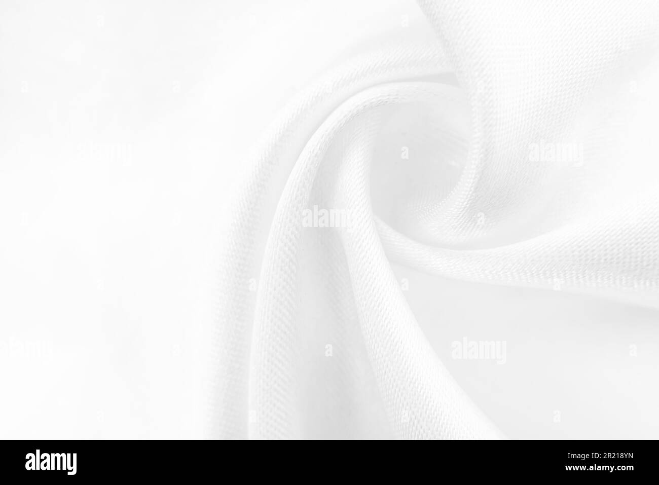 A twisted piece of white fabric. White material or texture with waves ...