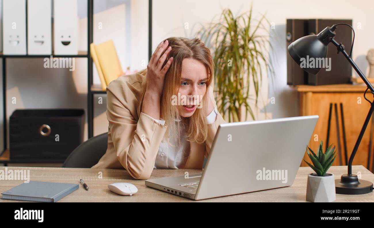 Angry business woman breaking laptop hi-res stock photography and ...